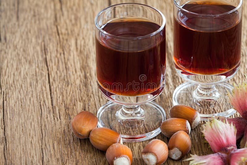 Hazelnut Liqueur in Two Glasses and Hazelnuts Stock Photo - Image of ...