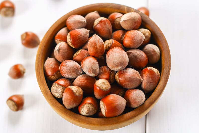 Hazelnut Nuts in a Wooden Bowl on a White Wooden Table. Superfood ...