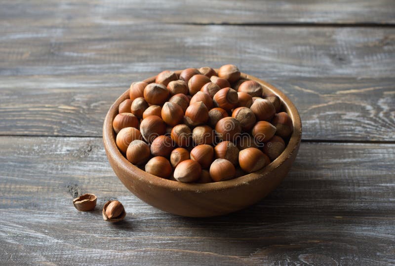 Hazelnut on a wooden table stock image. Image of fresh - 106200301