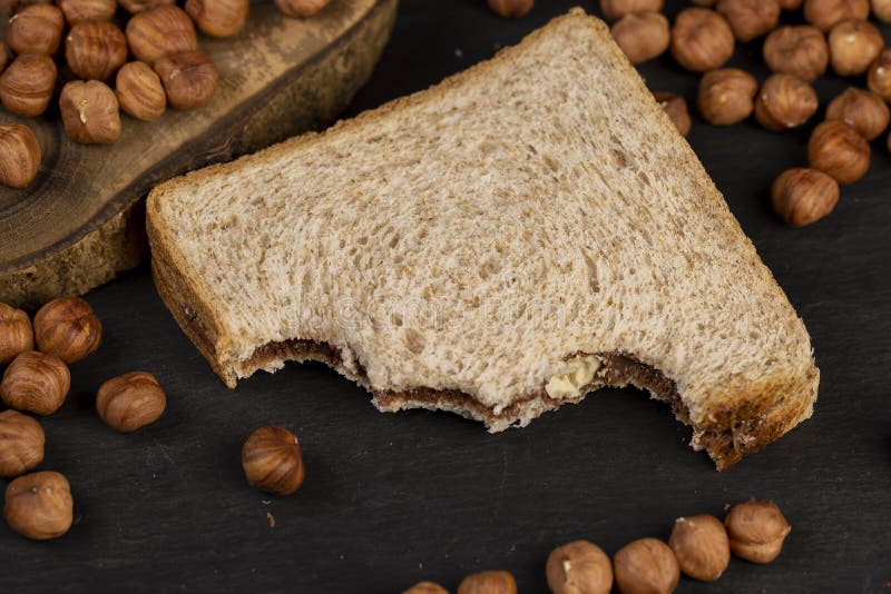 Hazelnuts and Bread with Nut Paste with Chocolate Stock Photo - Image ...