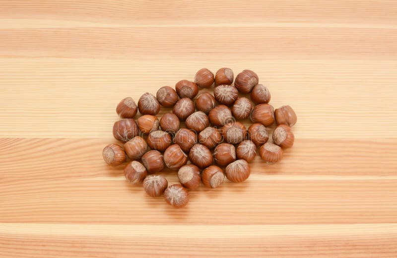 Hazelnuts in Shells on Wood Stock Photo - Image of plank, eating: 99765322
