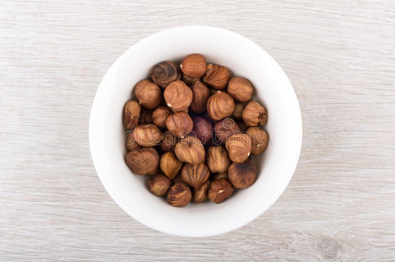 Hazelnuts in Small Glass Bowl on Table Stock Photo - Image of closeup ...