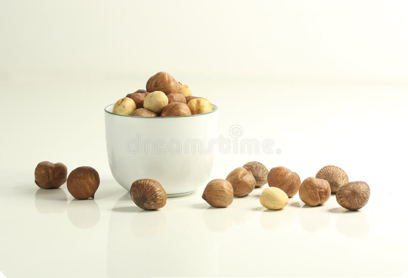 Hazelnuts on White Tableand in White Cup , Edible Seed Kernels ...