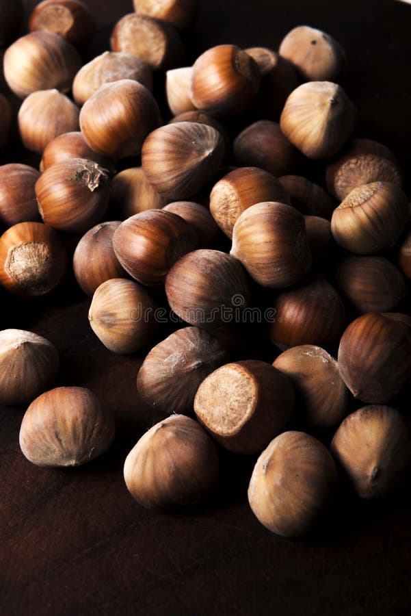 Hazelnuts on Dark Wooden Background Stock Image - Image of standing ...