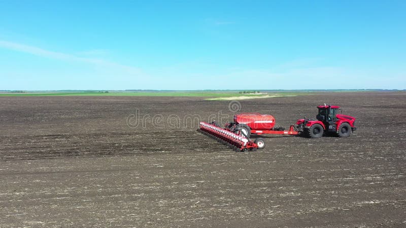 HD. Tractor with a Sowing Complex Works in the Field Stock Video ...