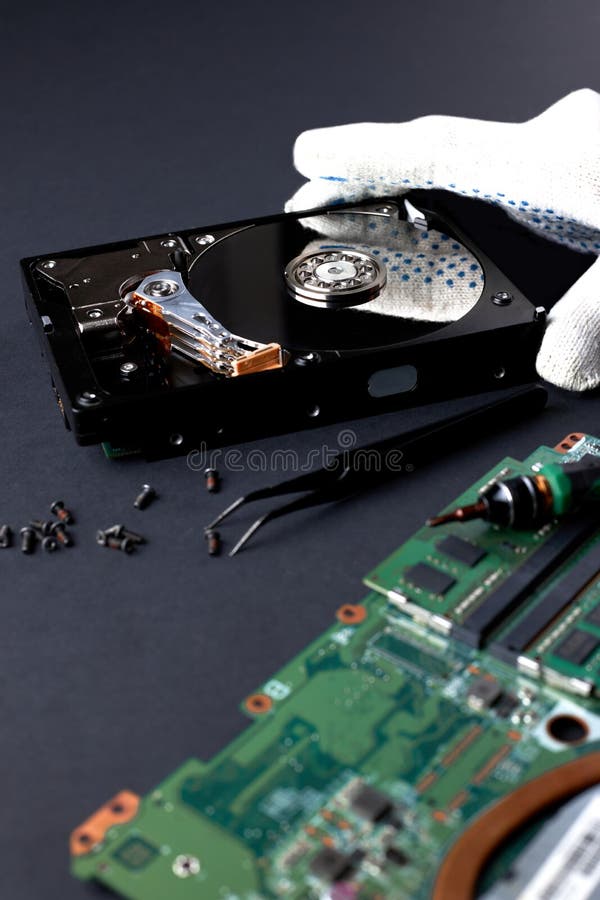 Repairs Broken Computer Hard Disk Drive by Engineer. Disassembled Hard ...