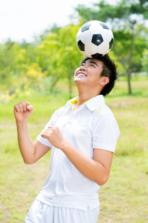 Head ball stock image. Image of asian, football, holding - 27565819