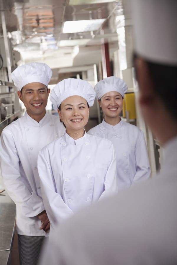 Head Chef Speaking To Assistants Stock Image - Image of mature, happy ...