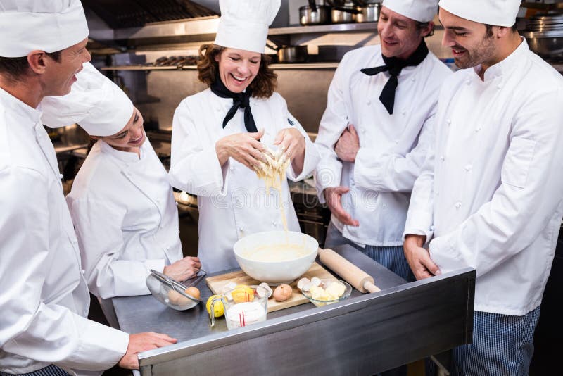 Team of Chef Tasting Food in the Commercial Kitchen Stock Photo - Image ...