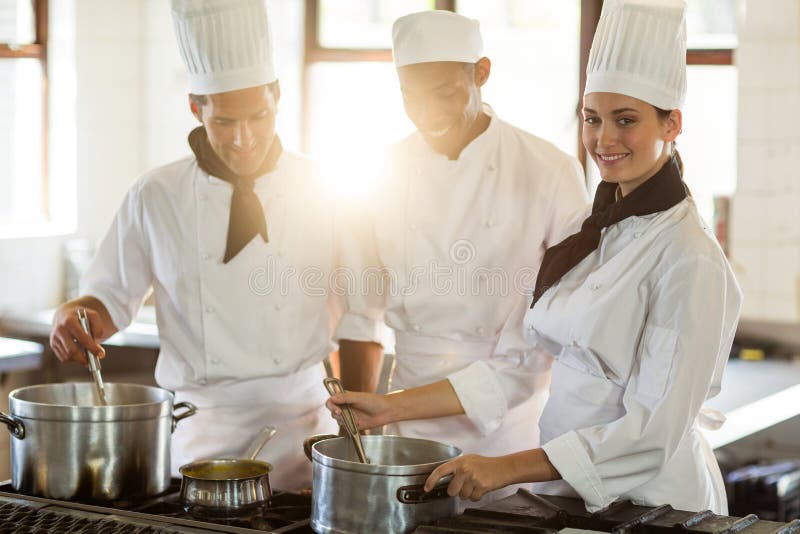 Head Chef Working Together with Her Colleague Stock Image - Image of ...
