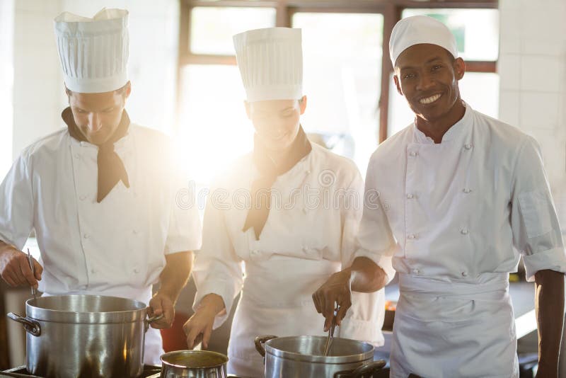 Head Chef Working Together with Her Colleague Stock Image - Image of ...