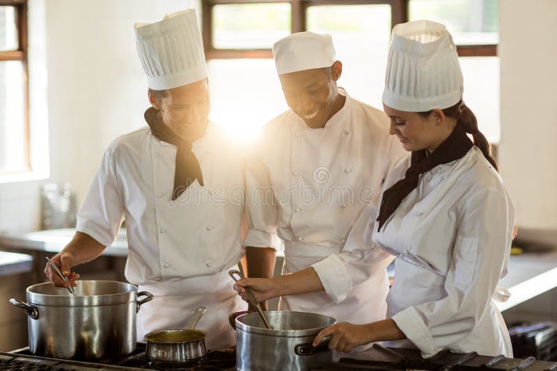 Head Chef Working Together with Her Colleague Stock Image - Image of ...