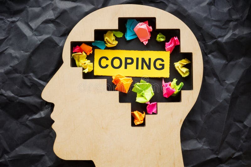 Head on a Dark Surface with an Inscription Coping and Colored Paper ...