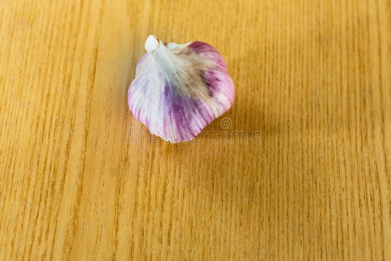 Head of Dried Blue Garlic on a Brown Background Stock Photo - Image of ...