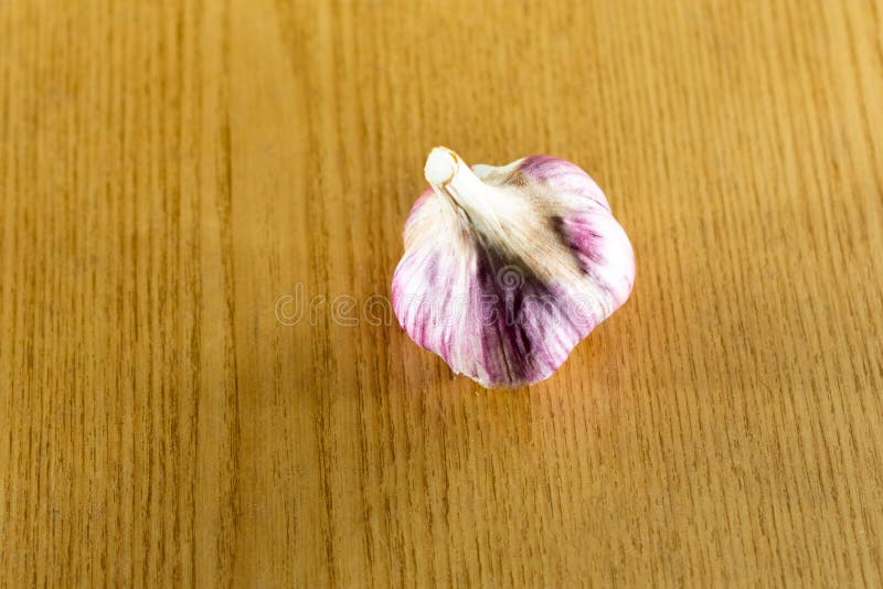 Head of Dried Blue Garlic on a Brown Background Stock Photo - Image of ...