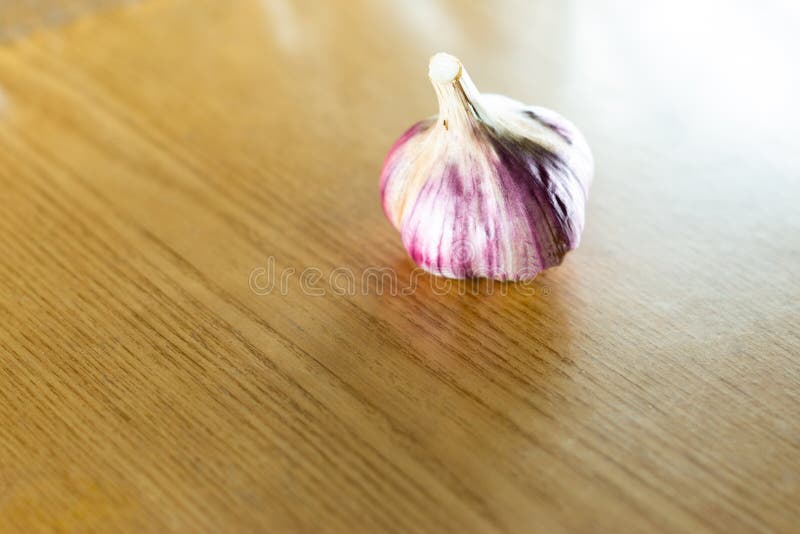 Head of Dried Blue Garlic on a Brown Background Stock Photo - Image of ...