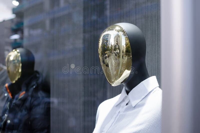 Head of a Dummy with a Gold Coating in the Shop Window. Stock Image ...