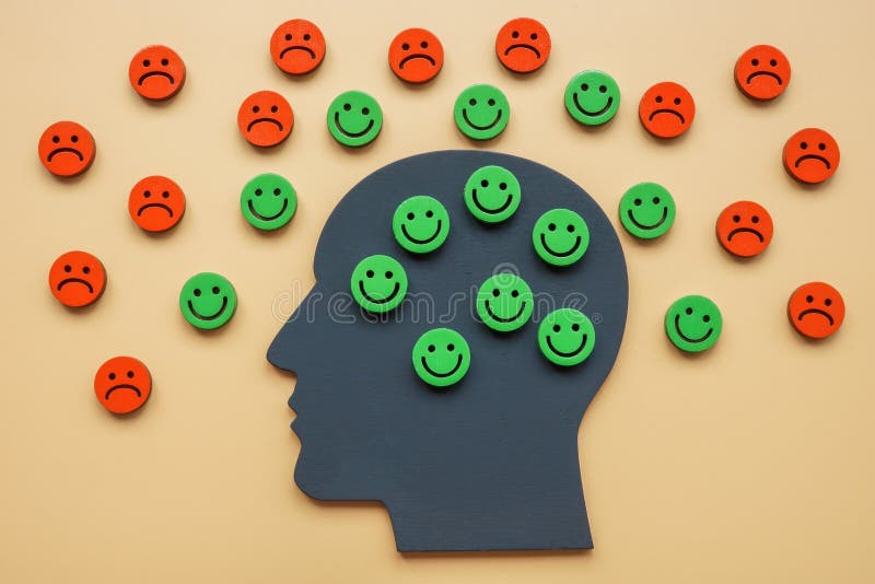 A Head with Happy Emoticons and a Sad Around As a Symbol of a Positive ...