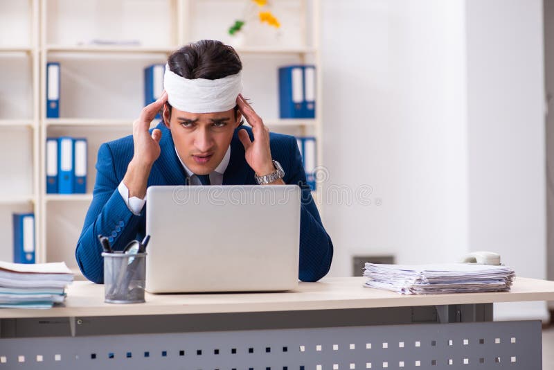 Head Injured Male Employee Working in the Office Stock Photo - Image of ...