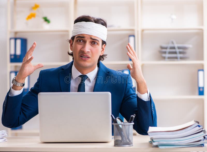 Head Injured Male Employee Working in the Office Stock Image - Image of ...