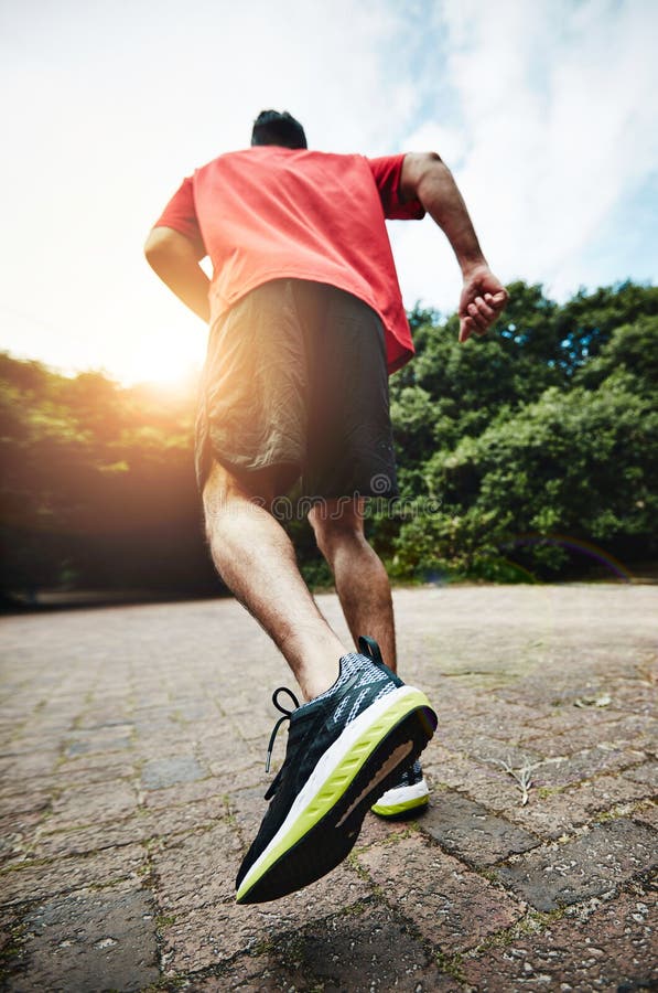 Head Out for an Exploratory Run. Rearview Shot of a Man Out for a Run ...