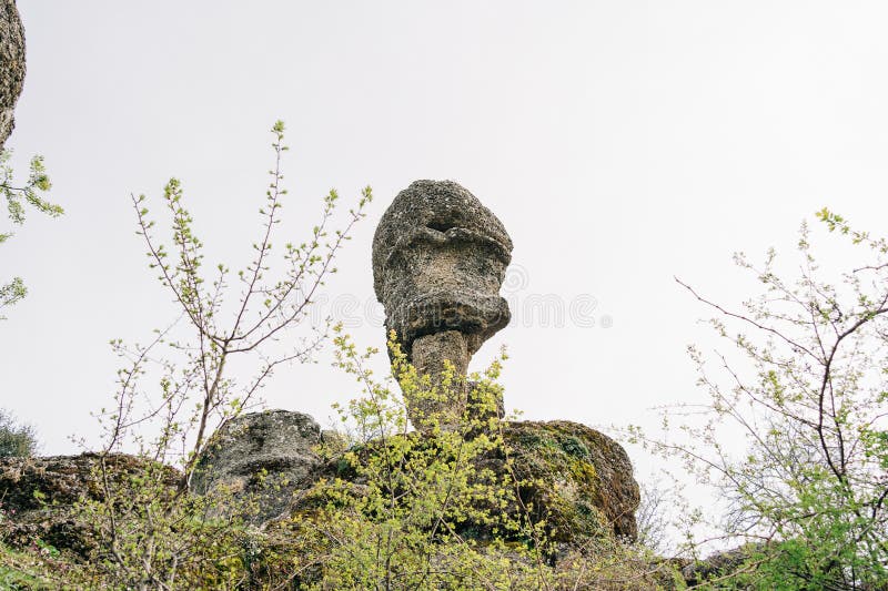 Head Shape Rock Boulder Standing on a Mountain Cliff. a Hanging Stone ...