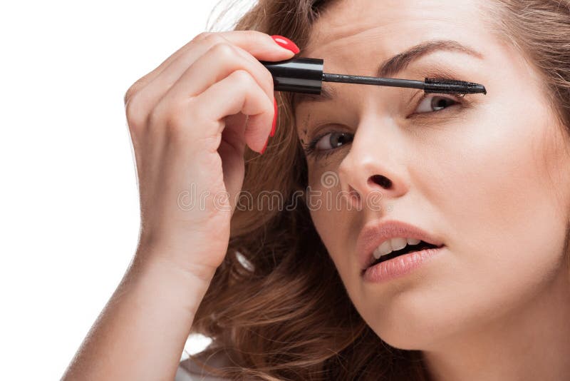 Head Shot of Focused Woman Applying Mascara Stock Image - Image of ...