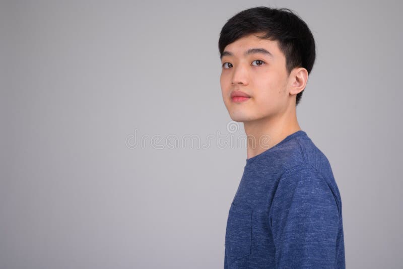 Head Shot Profile View of Young Asian Man Looking at Camera Stock Image ...