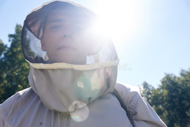 Young Apiarist in Sunlight stock image. Image of apiculturist - 115105653