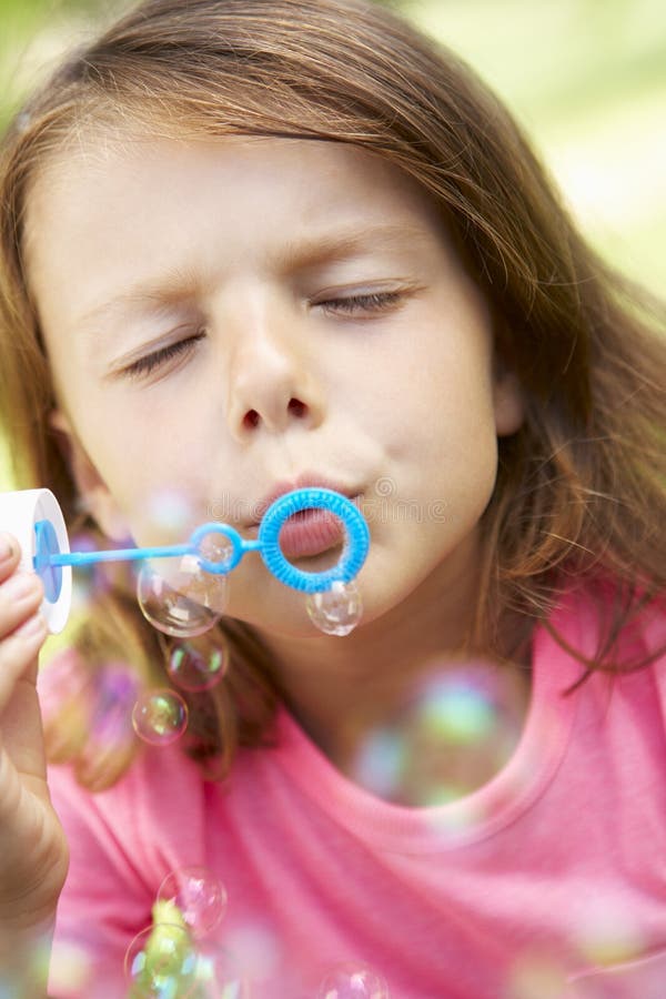 Head and Shoulders Portrait of Girl Blowing Bubbles Stock Image - Image ...