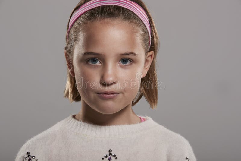 Sad Nine Year Old Girl Looking To Camera, Close Up Head Shot Stock ...