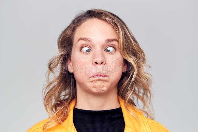 Head and Shoulders Studio Shot of Woman Pulling Faces and Smiling at ...