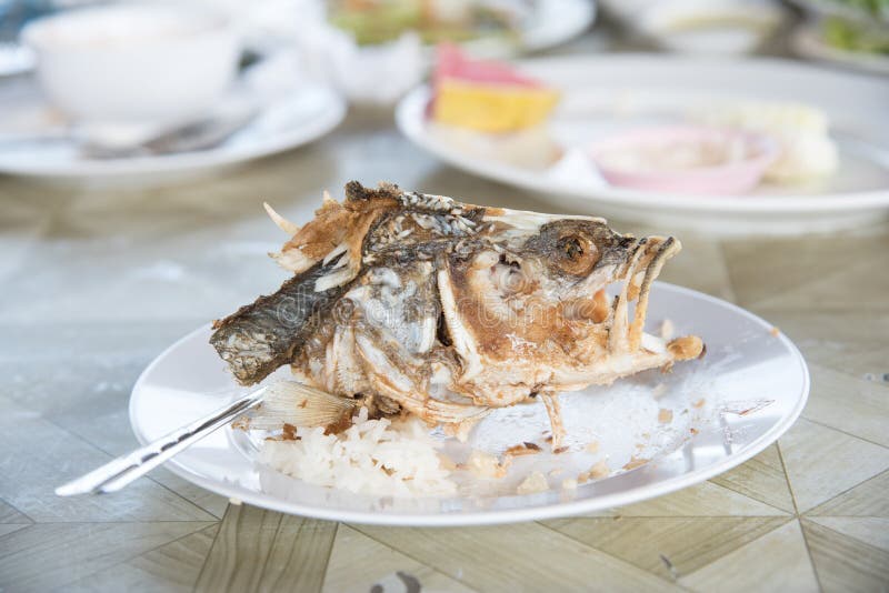 Head Skeleton of Fried Fish on Dish, it`s Delicious Food Stock Image ...