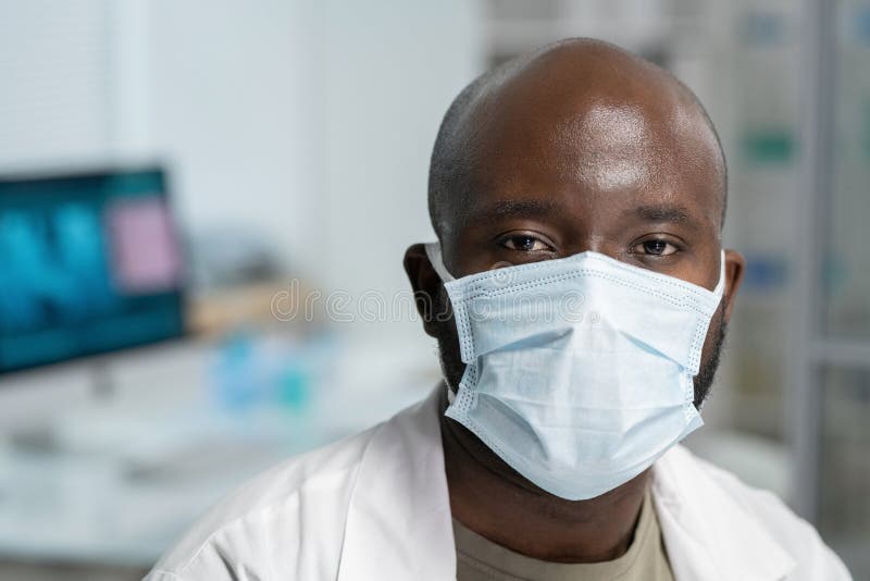 Head of Young Black Man in Protective Mask Looking at Camera Stock ...