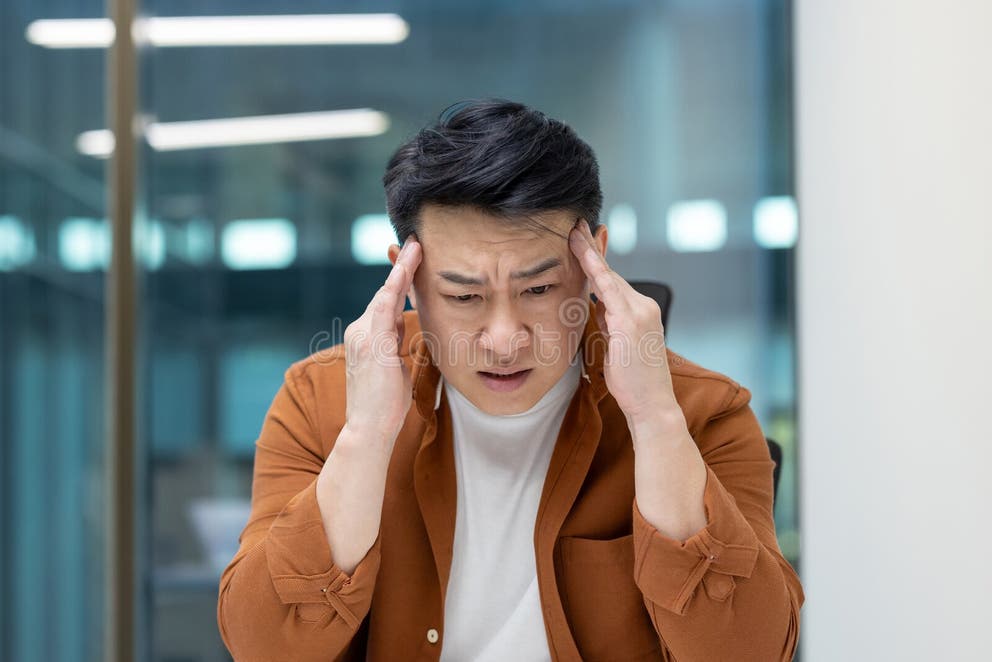 Headache in Office Worker at Workplace. Man Suffering from Migraine ...