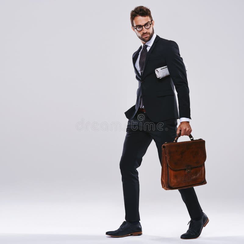 Headed To Work. Studio Shot of a Handsome and Well-dressed Young Man ...