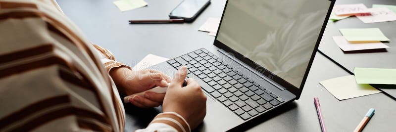 Header Image of Woman Studying in Class Using Laptop at Desk Indoors ...