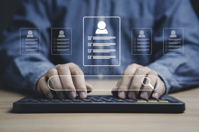 Headhunter Using Computer To Check and Select the Optimum Resume ...