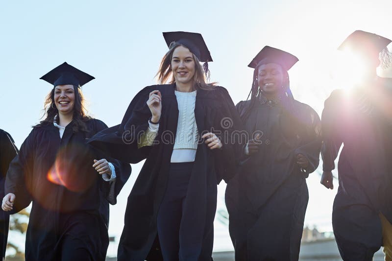 Heading Off into a Bright New Future. a Group of Students Running ...