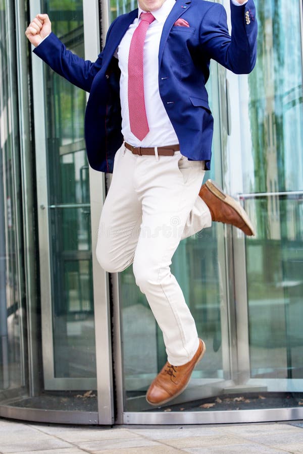 Headless Businessman Jumping in Front of Office Building Stock Image ...