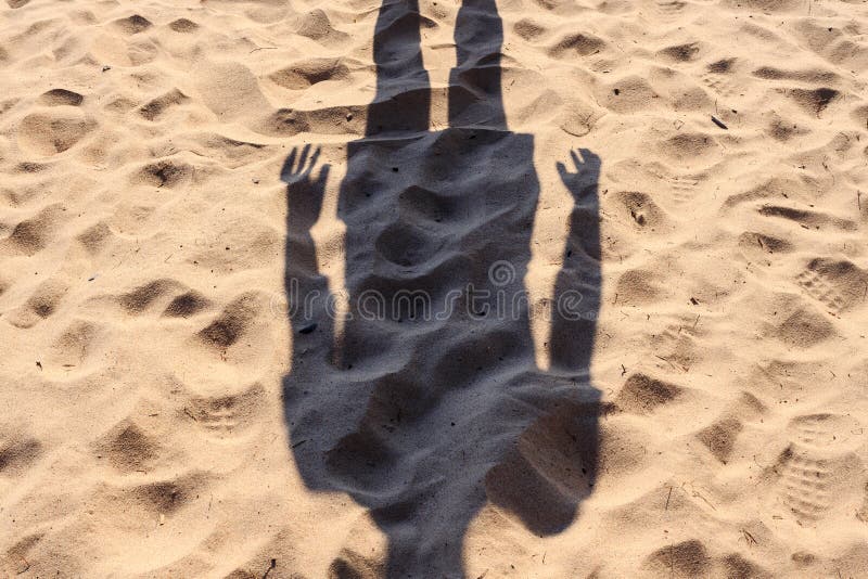 Headless Human Shadow on a Sandy Beach, on a Sunny Summer Day. Stock ...