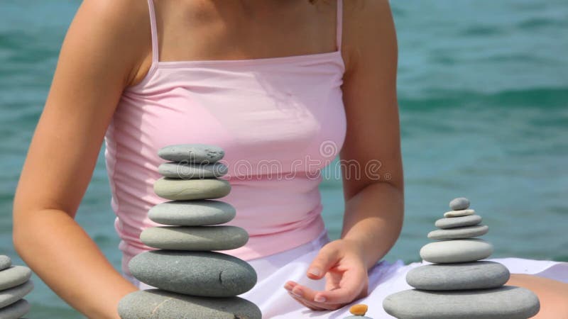 Headless Woman Building Stone Stack on Pebble Stock Footage - Video of ... Headless Woman Building Stone Stack on Pebble Stock Footage - Video of ...