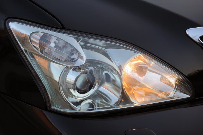 Headlight of the Main Light of the Black Car, Close-up. Stock Image ...