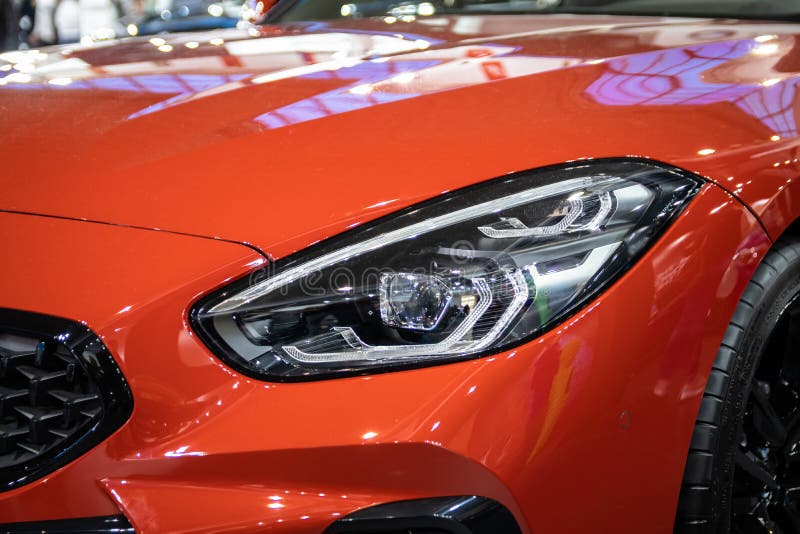 Headlight of Orange Modern Car with LED Light Stock Photo - Image of ...