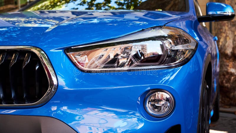 Headlights of blue car stock photo. Image of machine - 138540060
