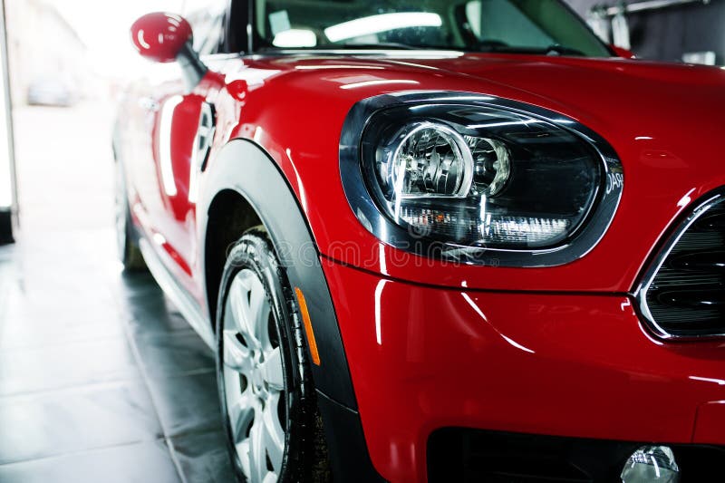 Headlights and Hood of Sport Red Car in Garage Stock Photo - Image of ...