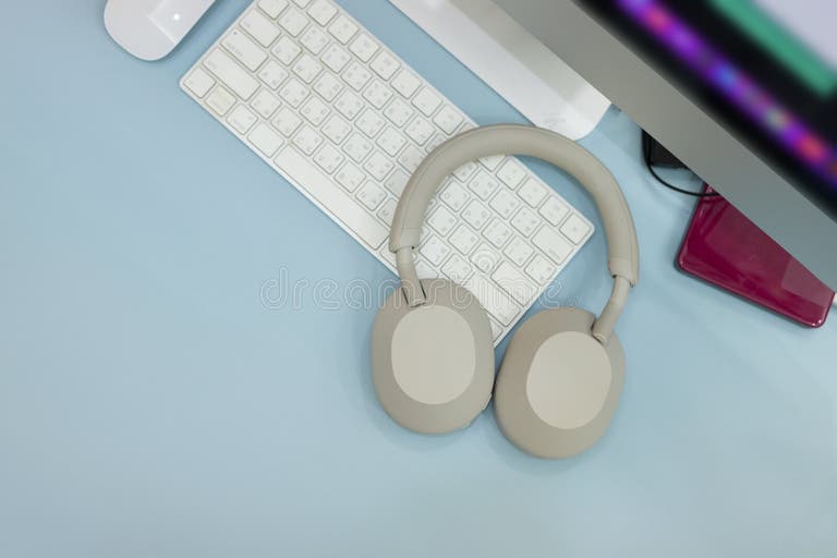 Headphone on Computer at Workplace Office Table. Audio Digital ...