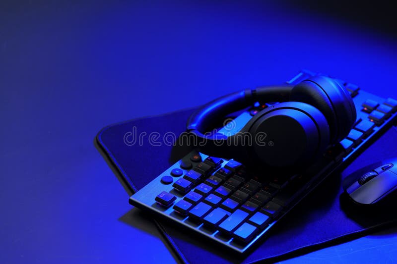 Headphones, Computer Mouse and Keyboard on Black Background Stock Photo ...