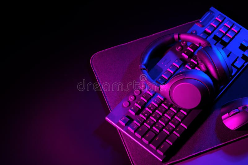 Headphones, Computer Mouse and Keyboard on Black Background Stock Photo ...