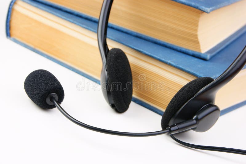 Headphones with a Microphone and Books Stock Image - Image of stack ...